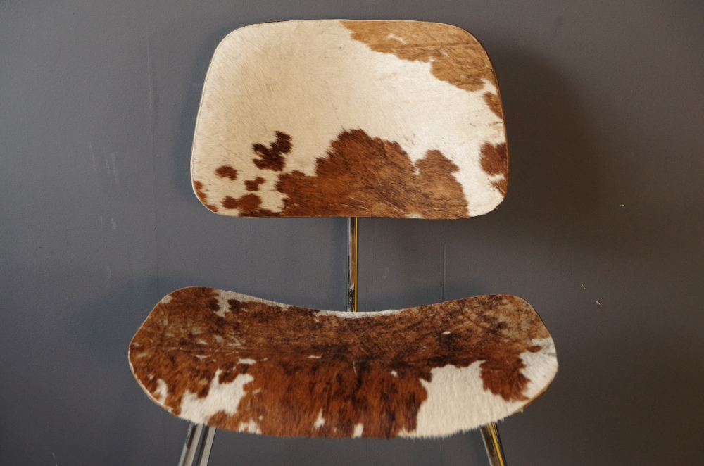 Eames DCM Plywood Chair with Cowhide Upholstery | EBTH