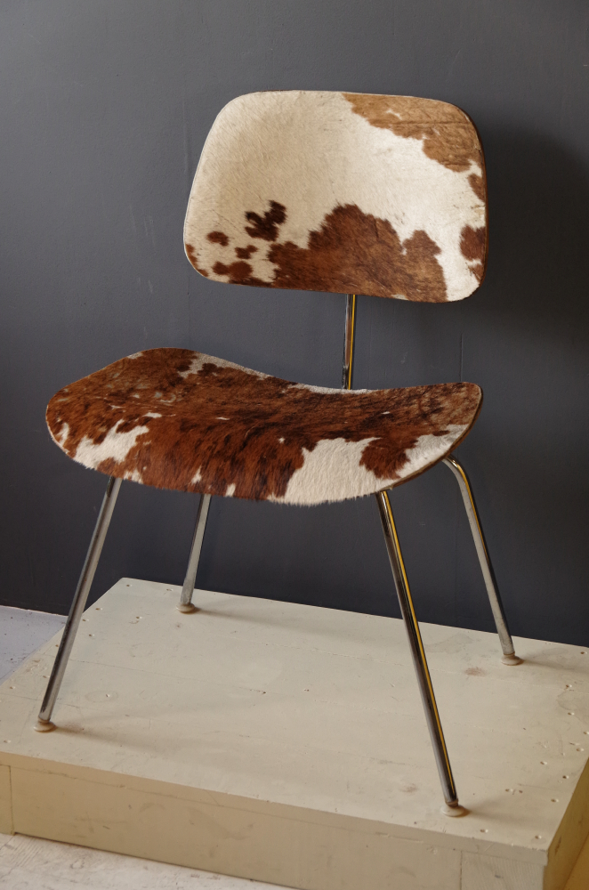 Eames DCM Plywood Chair with Cowhide Upholstery | EBTH
