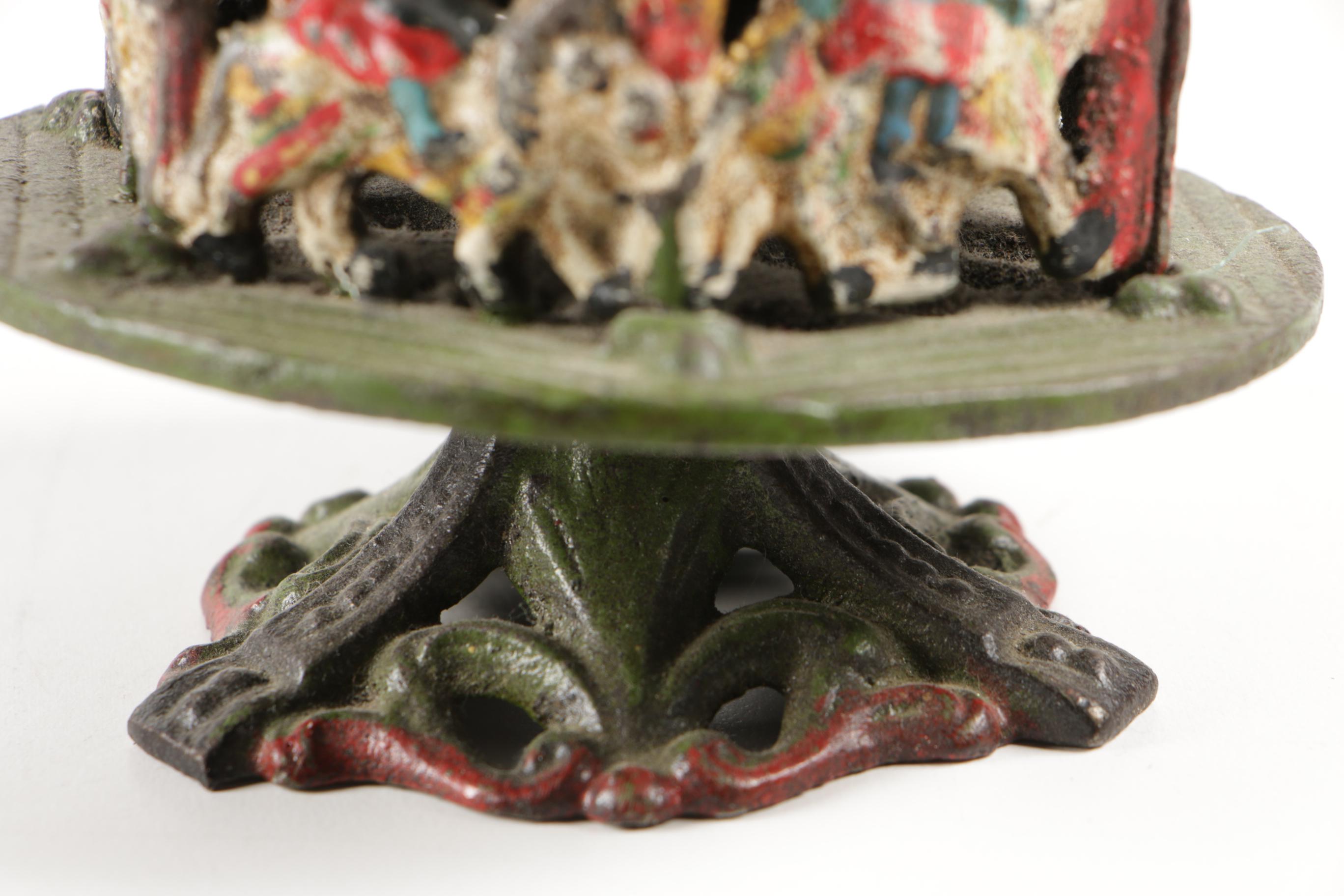 Rotating Painted Cast Iron Carousel Coin Bank, Antique | EBTH