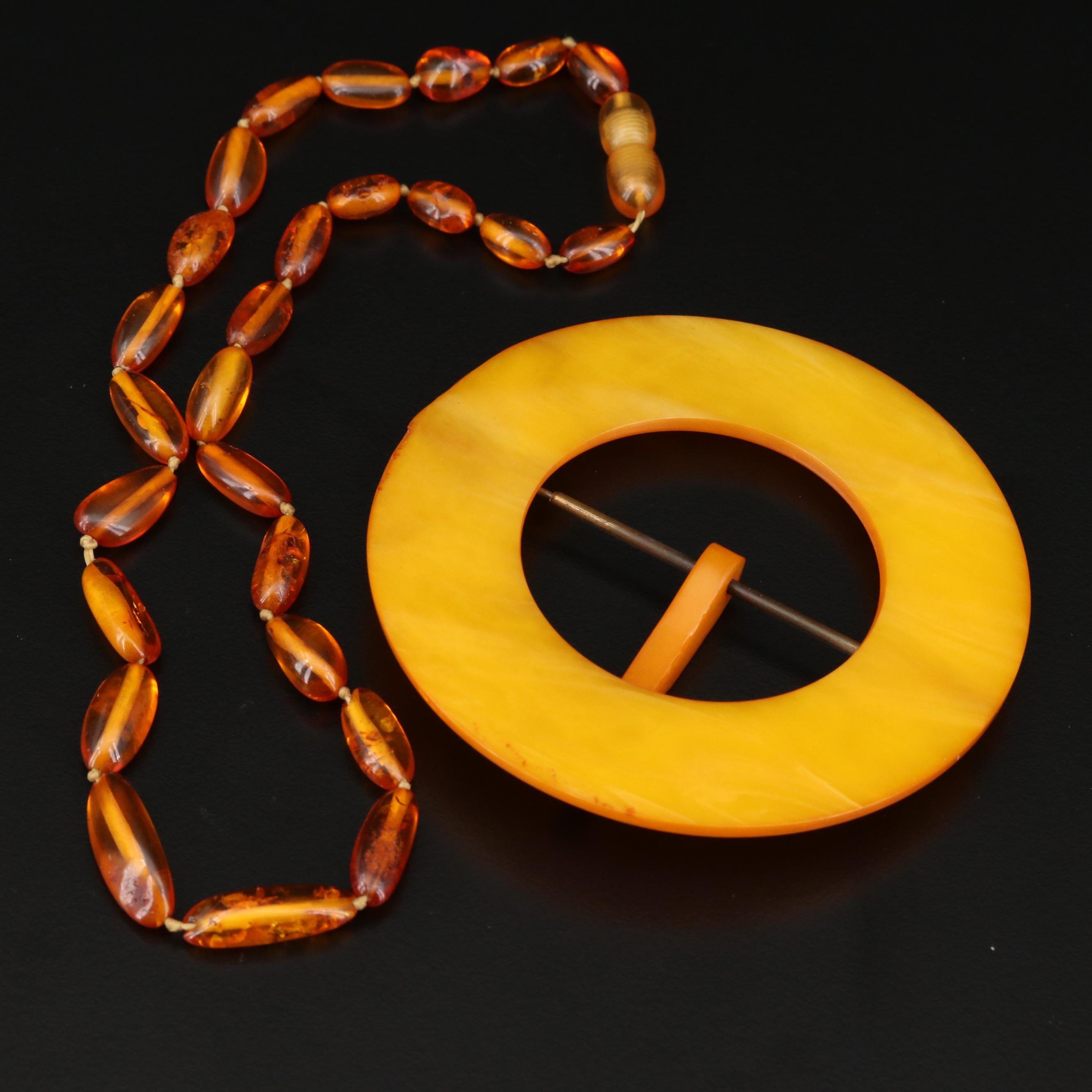 Amber and Copal Resin Necklace and Bakelite Belt Buckle | EBTH