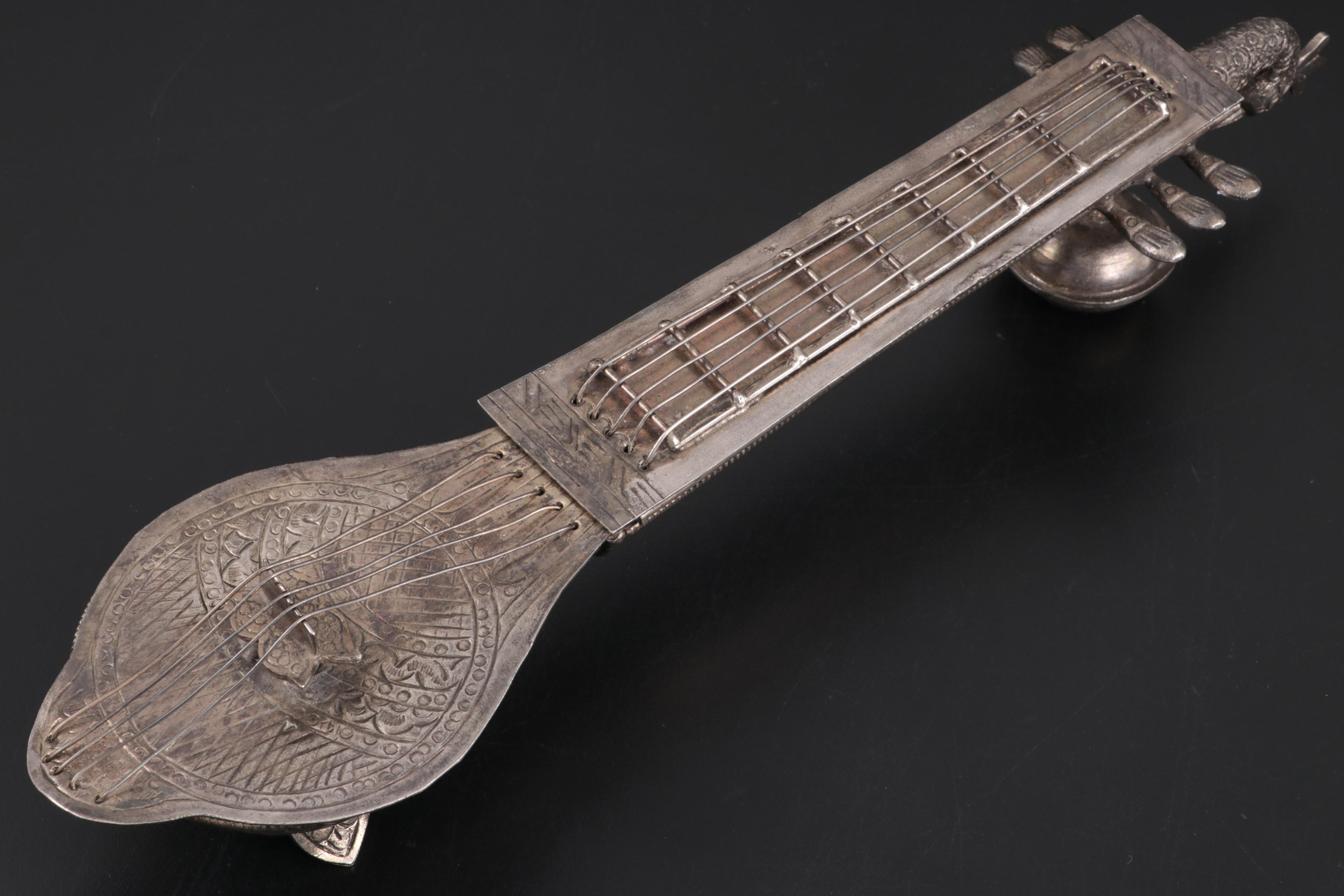 Sitar Shaped Metal Perfume Box with Pressed Metal Embellished Orbs ...