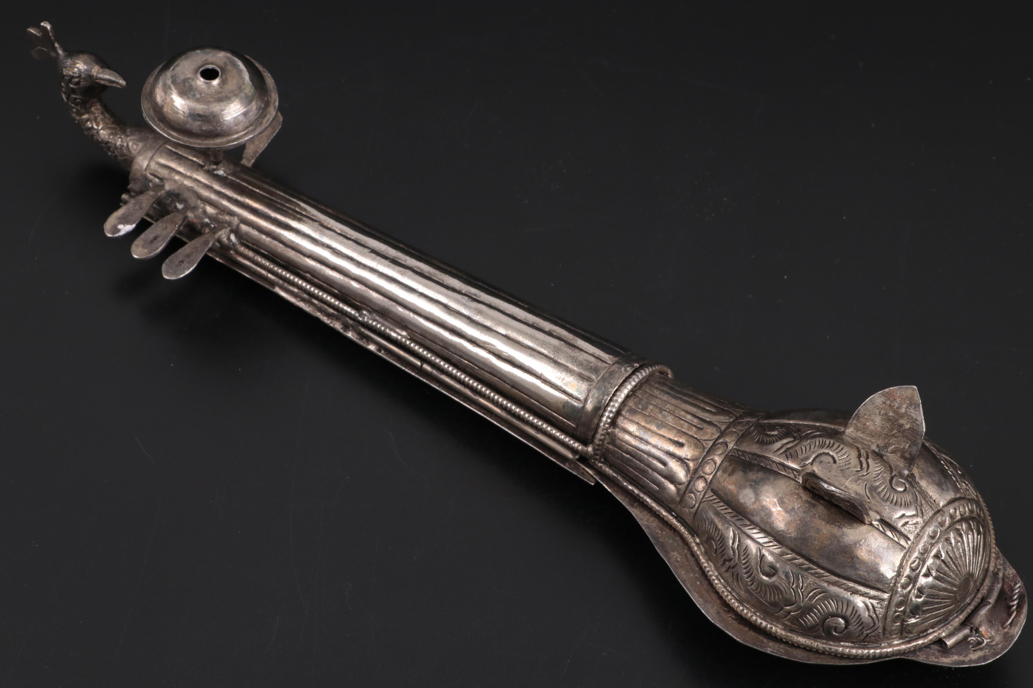 Sitar Shaped Metal Perfume Box with Pressed Metal Embellished Orbs ...