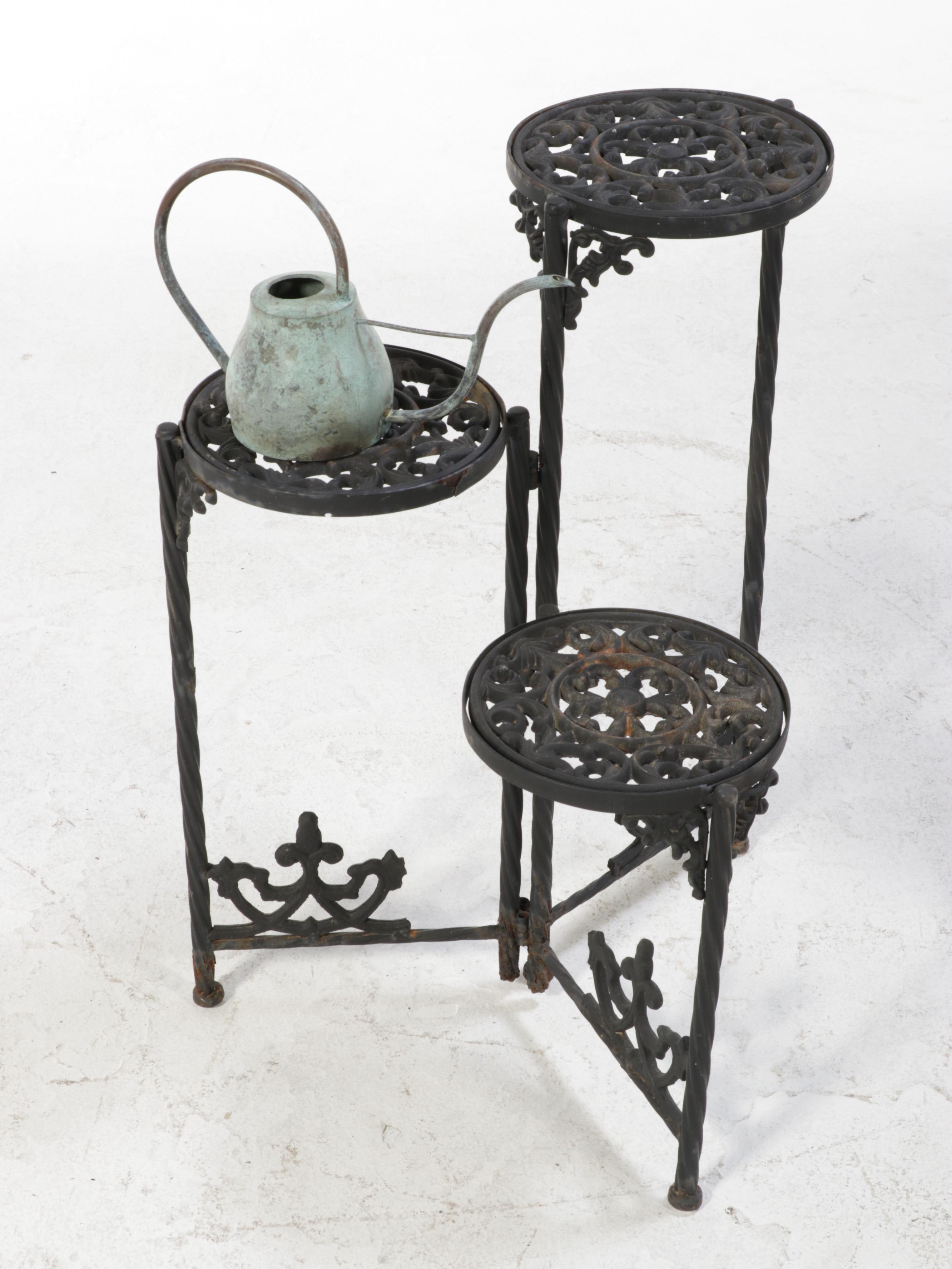 Cast Metal Three-Tier Plant Stand, Galvanized Metal Watering Can, and ...