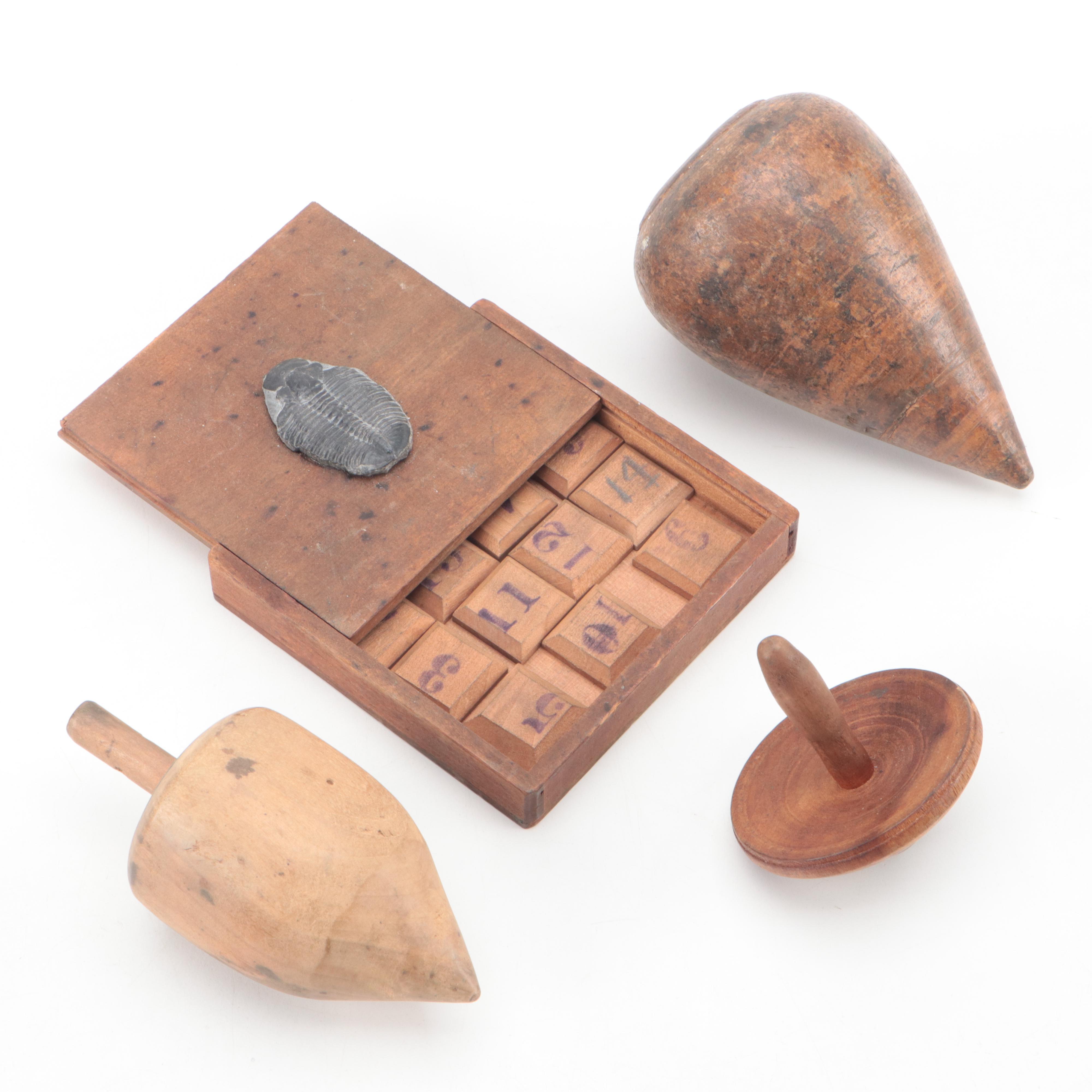 Trilobite Wooden Box with Number Tiles and Carved Wood Spinning Tops | EBTH