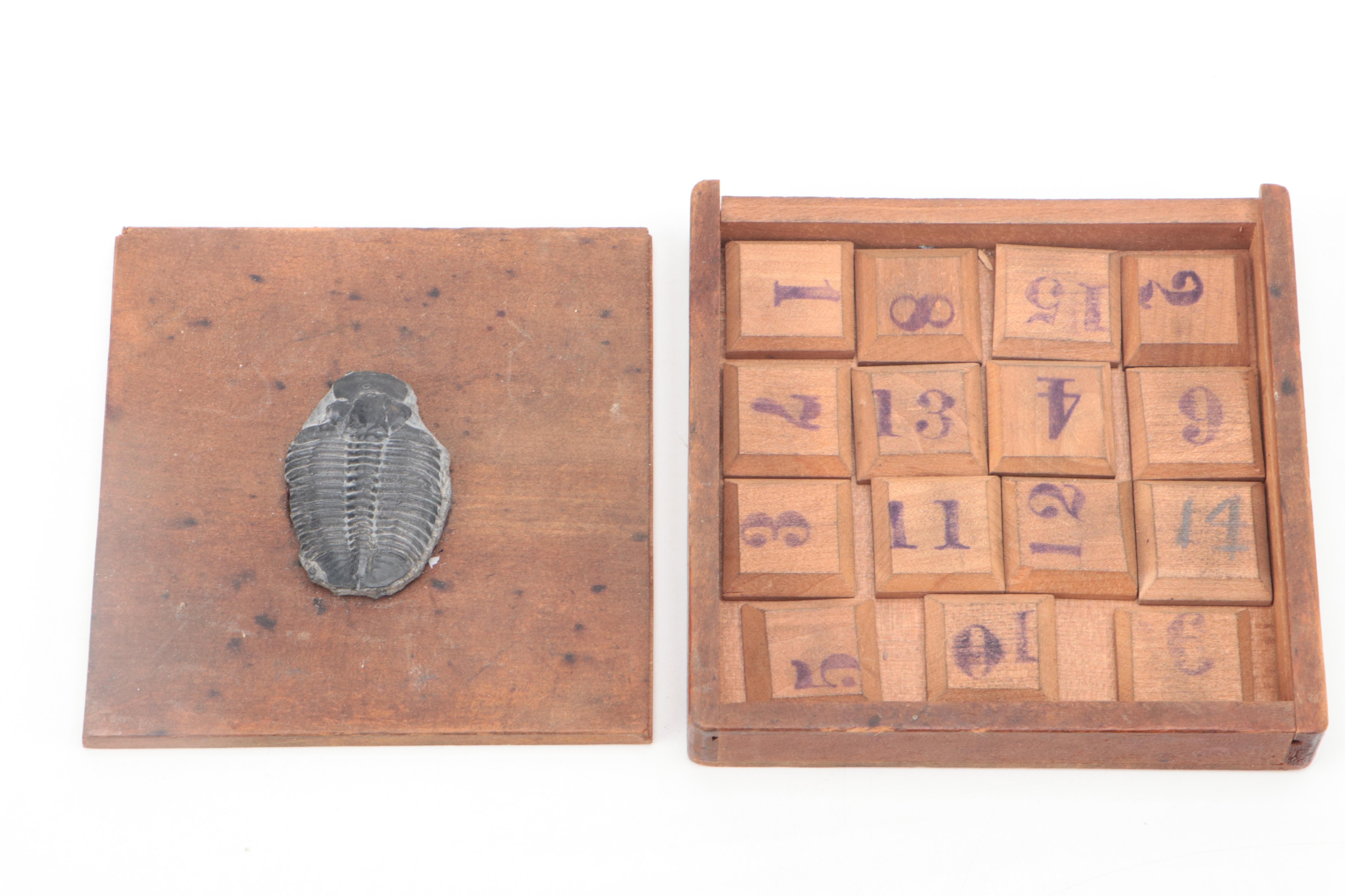 Trilobite Wooden Box with Number Tiles and Carved Wood Spinning Tops | EBTH