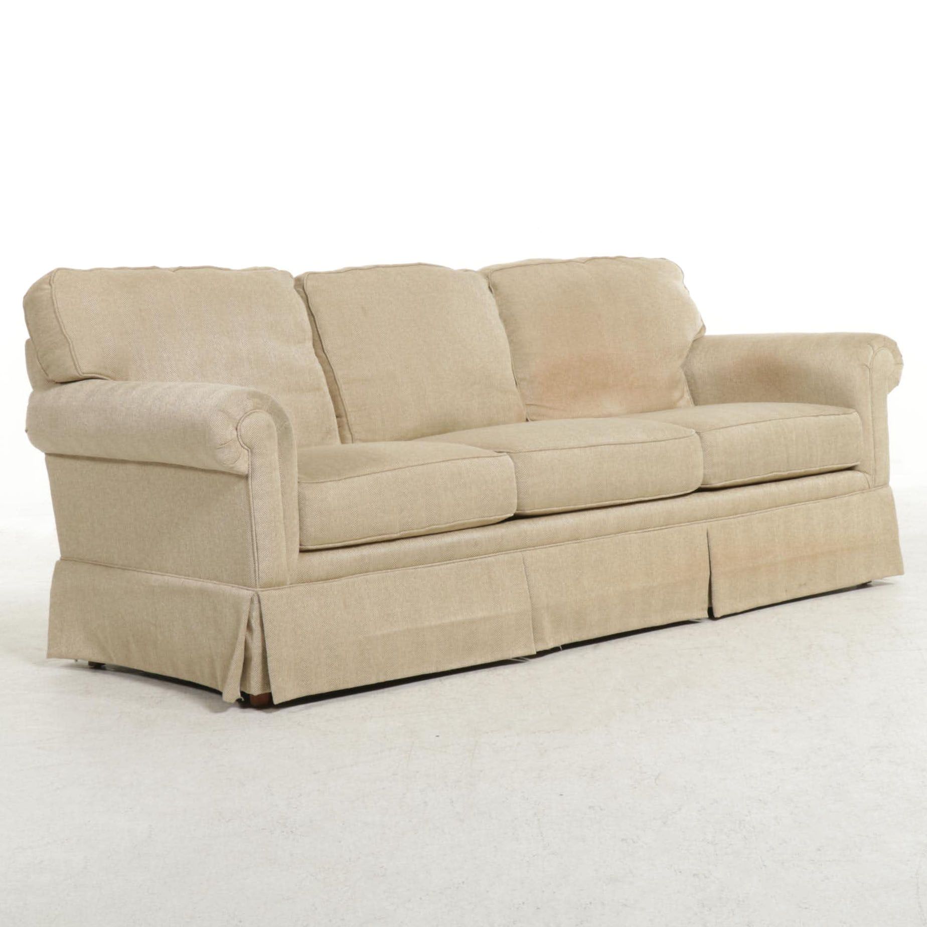 Broyhill Skirted and Roll Arm Three-Seat Sofa | EBTH