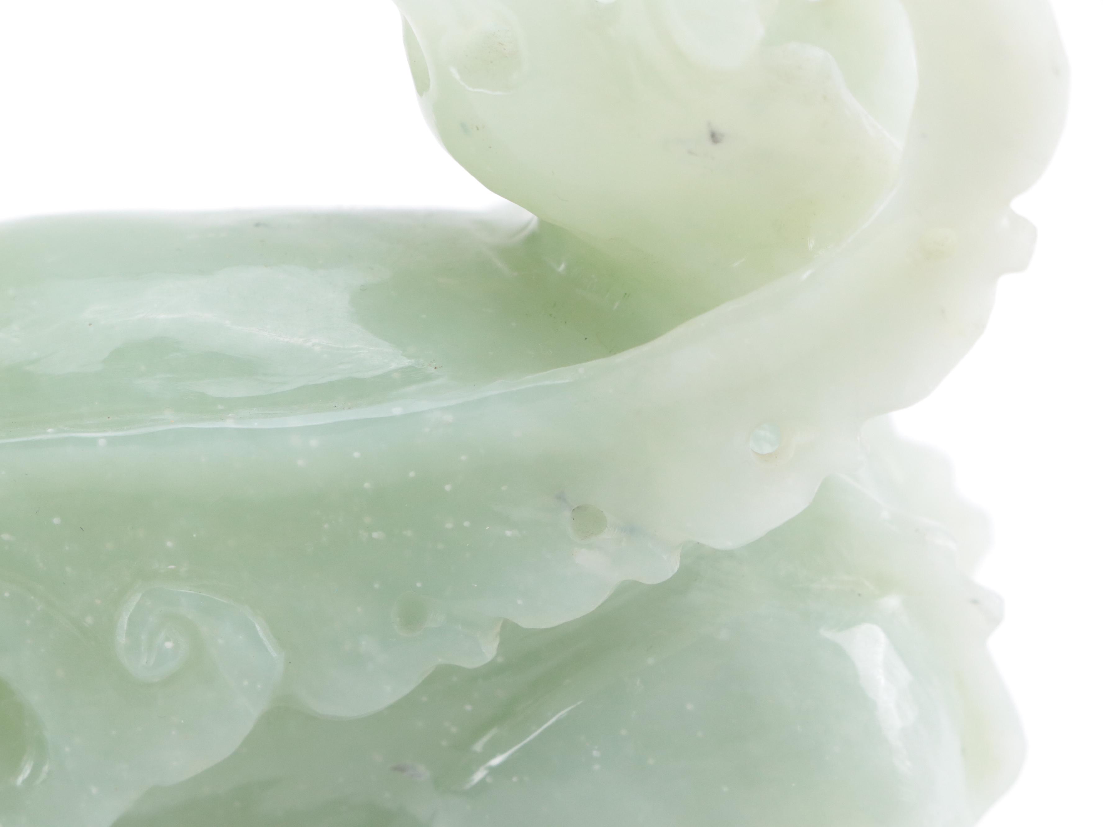 Chinese Carved Serpentine Guardian Lion Figure with Rosewood Color Base ...