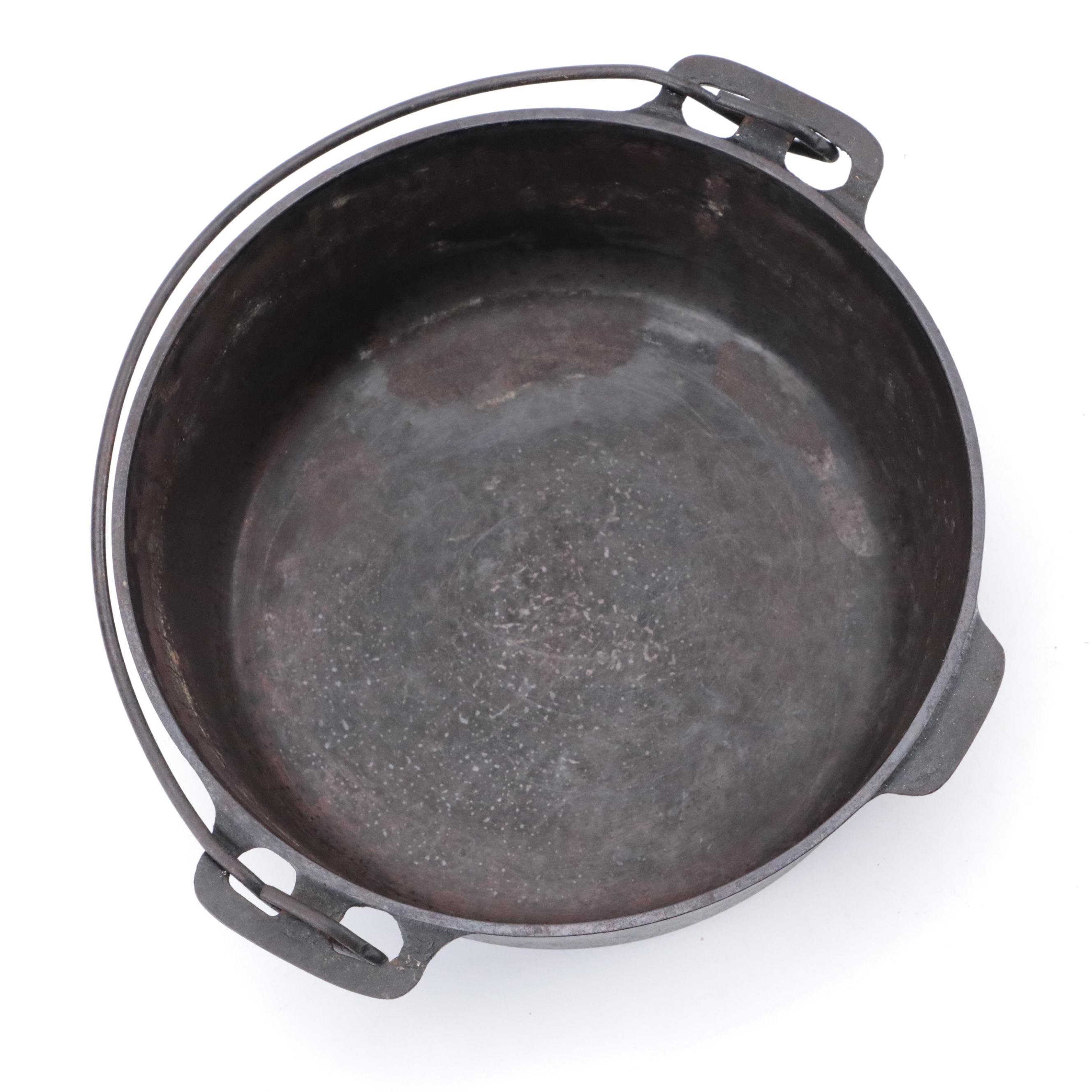 Wagner Cast Iron Dutch Oven with Trivet and Spring Scale | EBTH