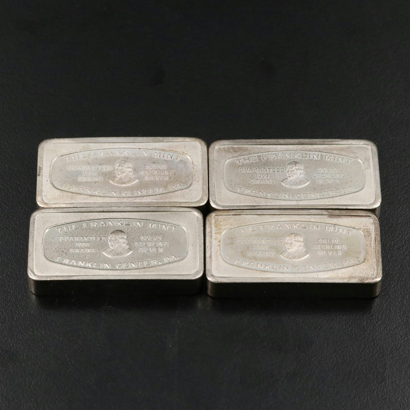 Four Franklin Mint Sterling Silver Ingots | EBTH Four Franklin Mint Sterling Silver Ingots | EBTH