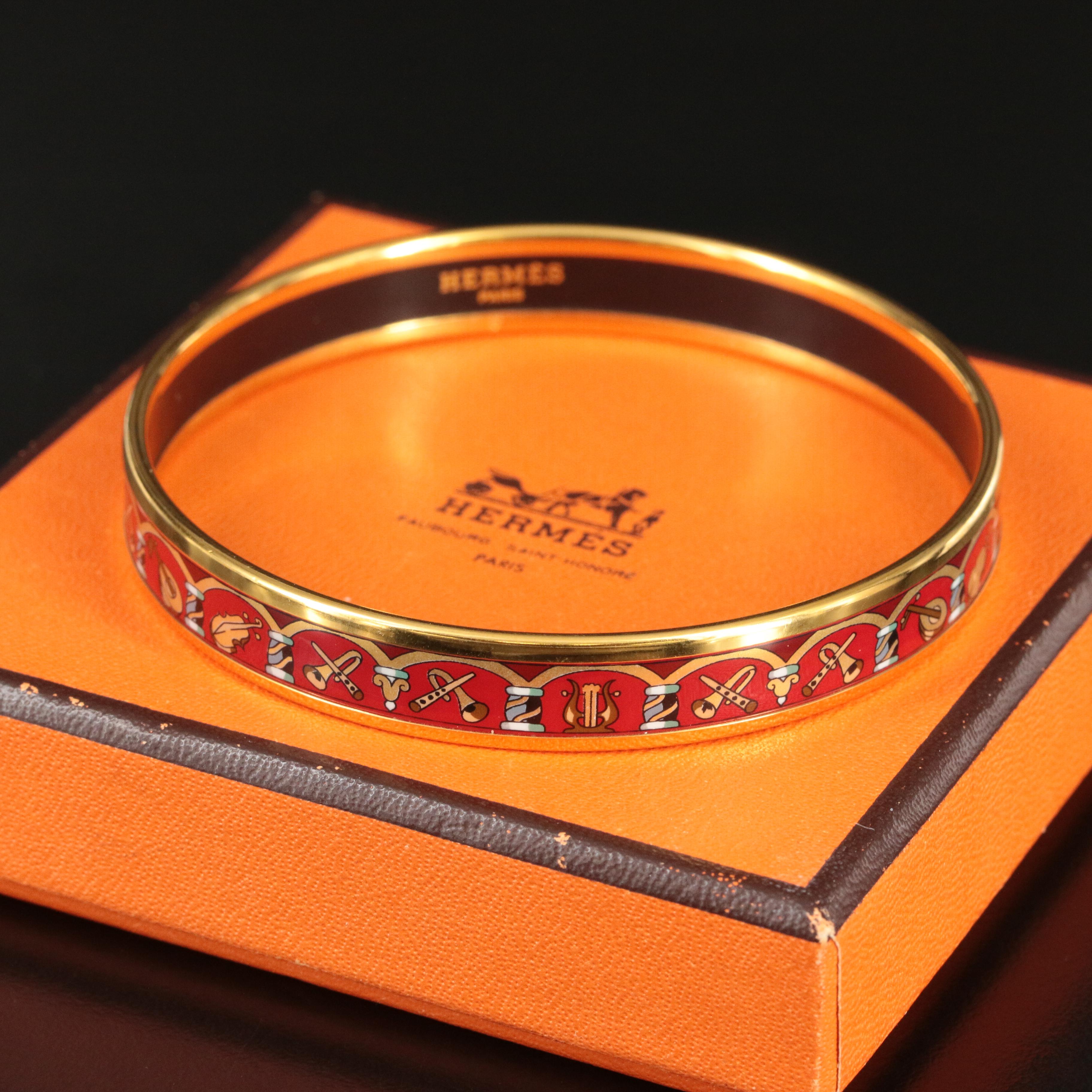 Hermès Musical Instruments Narrow Red Enamel Bangle | EBTH