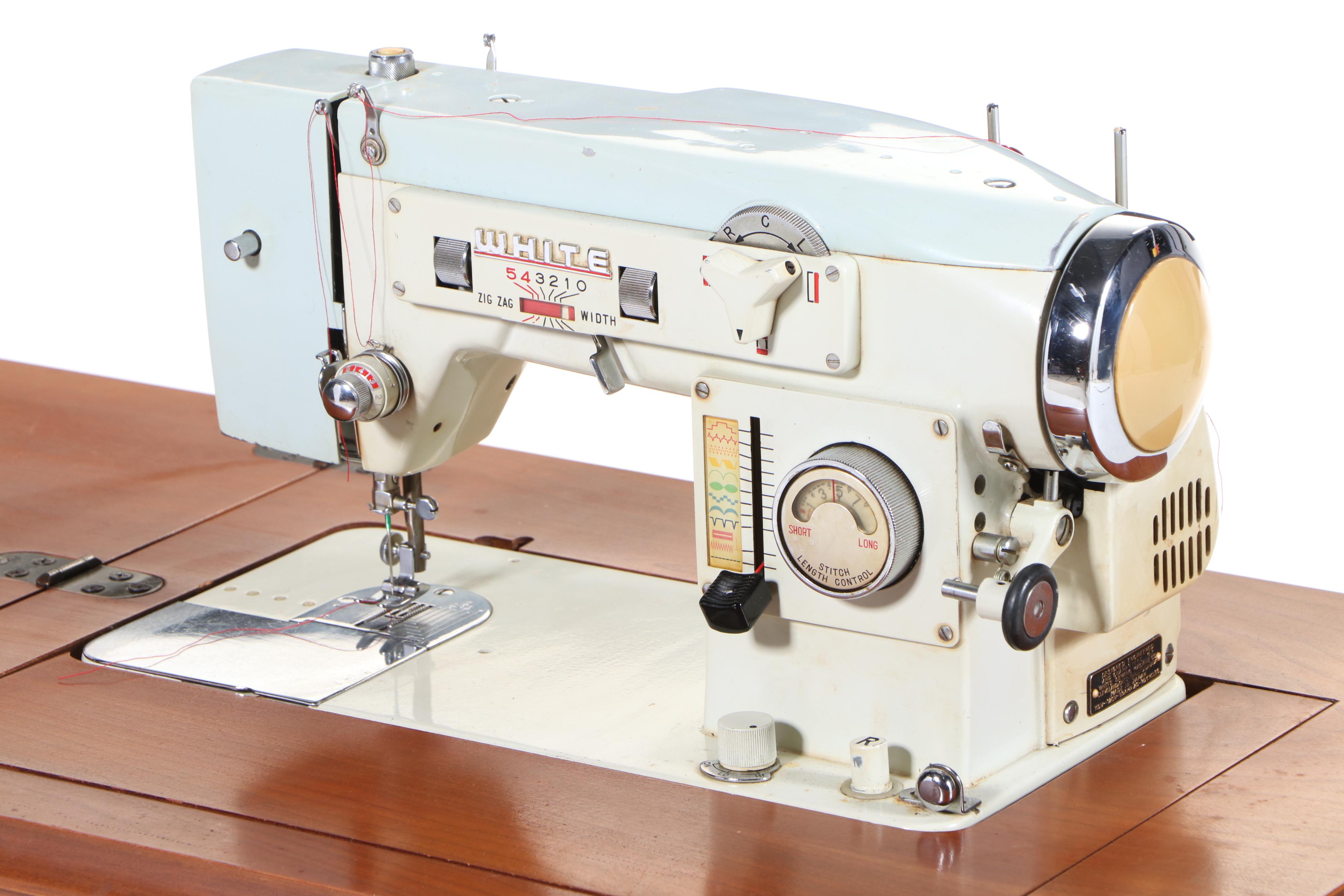 White Model 578 Sewing Machine with Wood Cabinet, Mid-20th Century | EBTH