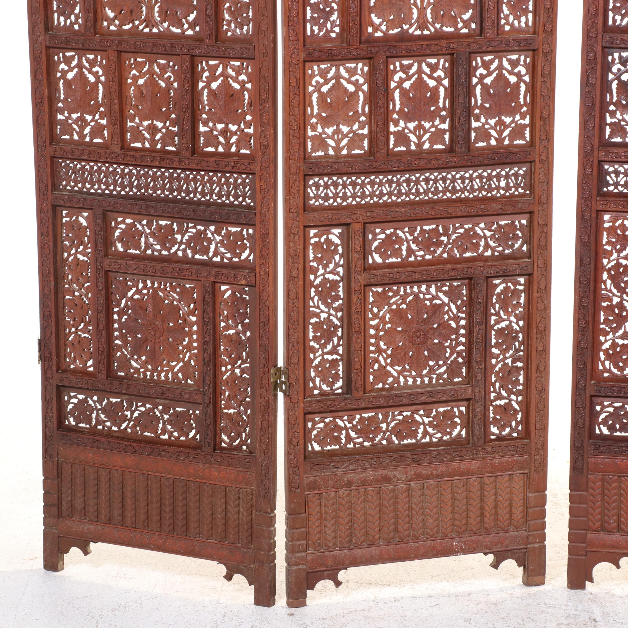 Pair of Indian Carved and Reticulated Teak Two-Panel Folding Screens | EBTH