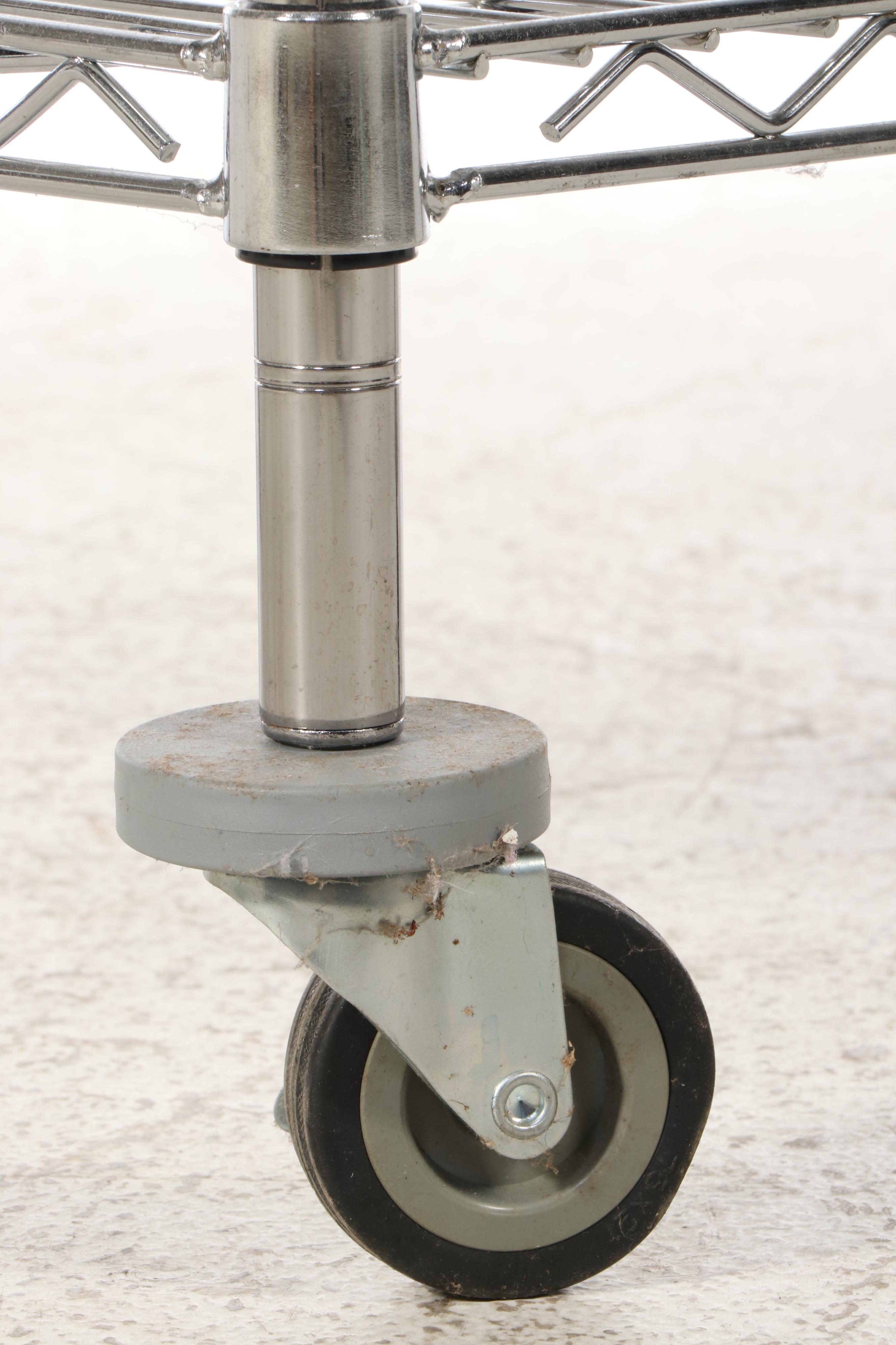 Three Chromed Metal Shelves on Wheels | EBTH