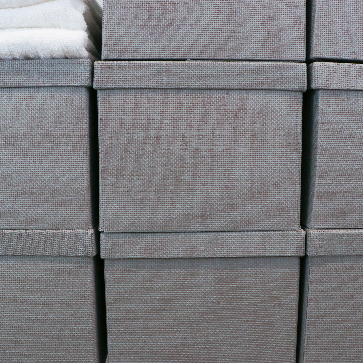 Grey Fabric Shoe Storage Cubes with Bath Linens and Clothes Hangers ...