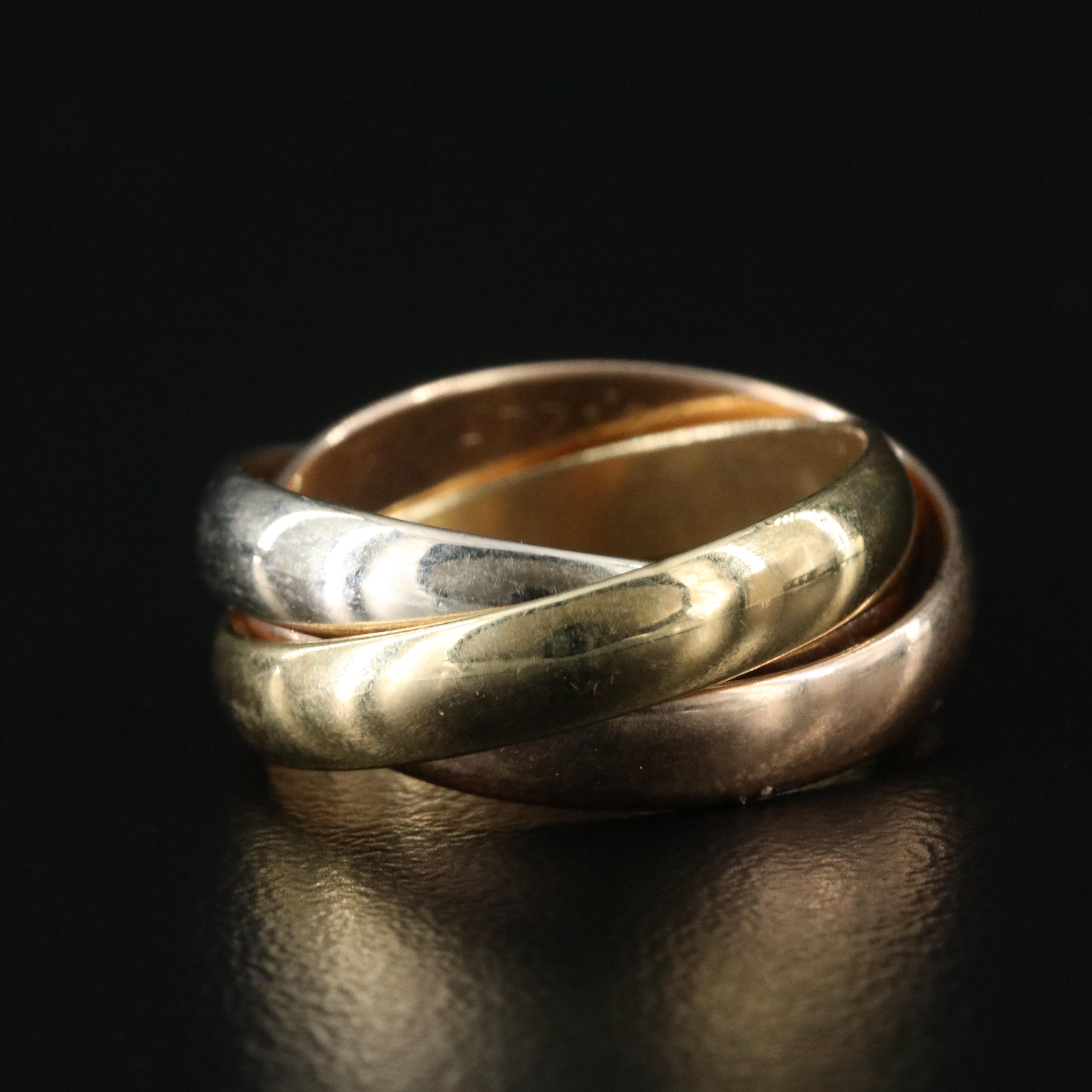 Les Must de Cartier 18K Tri-Color Trinity Rolling Ring | EBTH