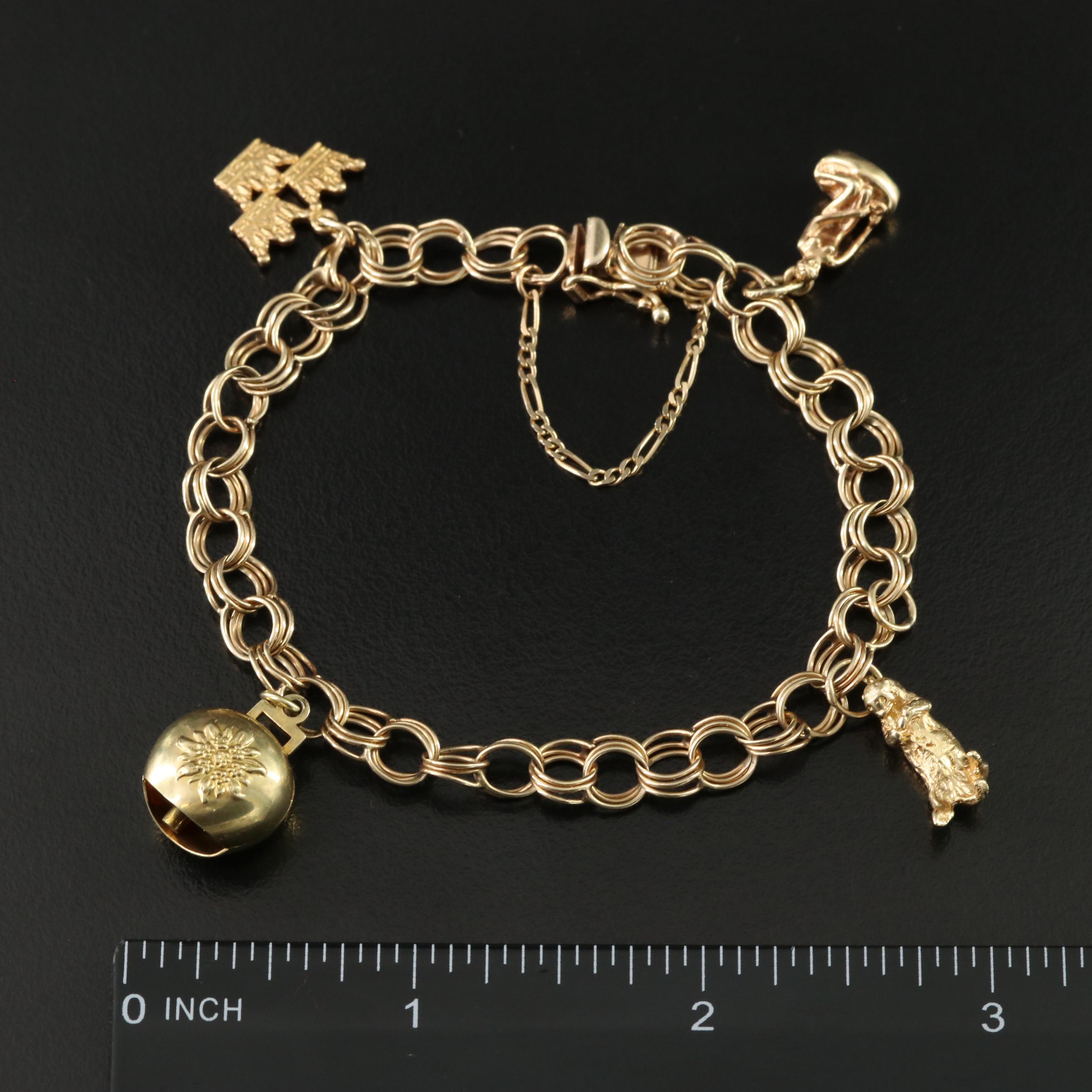14K Charm Bracelet with Cowbell, Otter, Figural & 18K Swedish Three ...