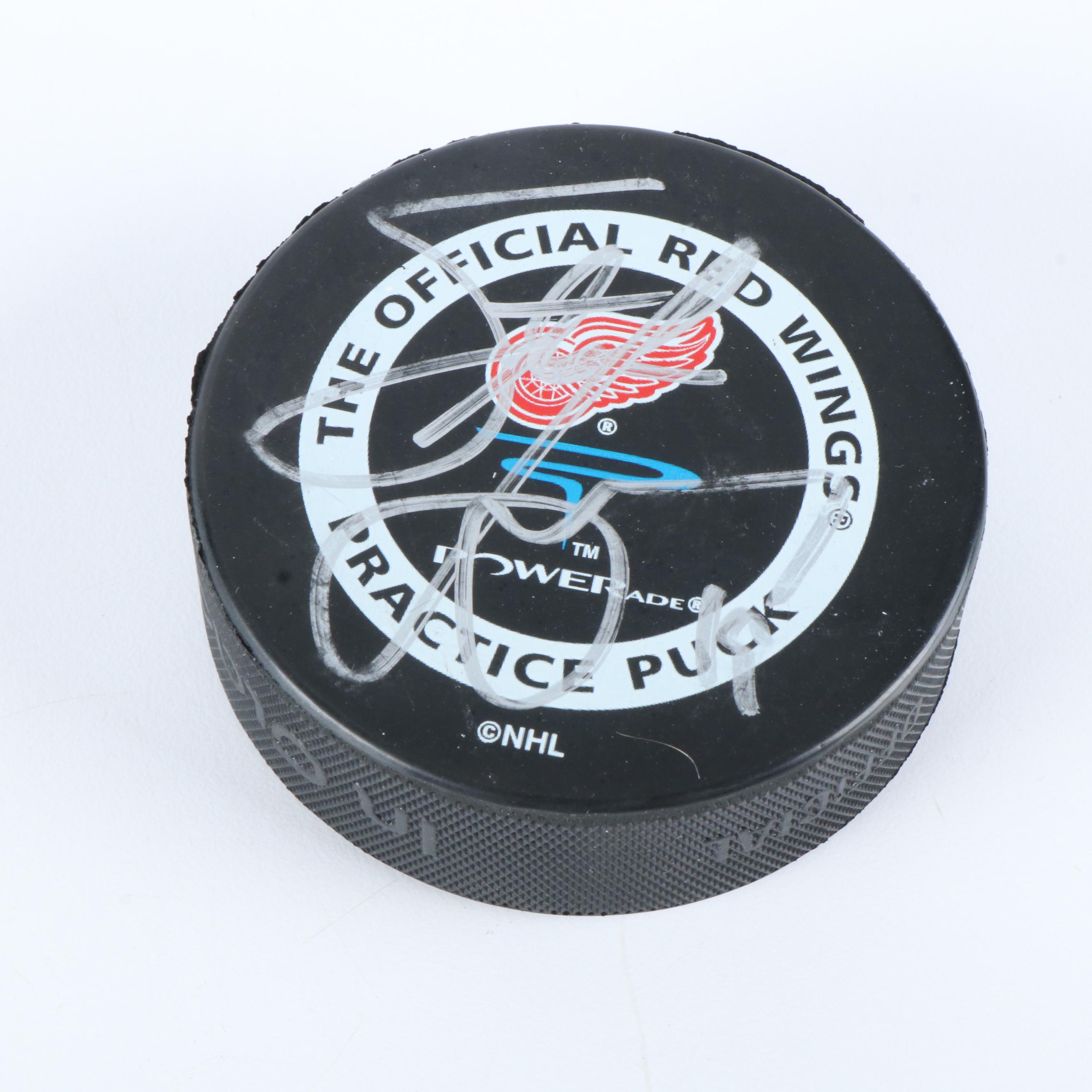 Bobby Hull and Steve Yzerman Signed NHL Hockey Pucks, Beckett | EBTH