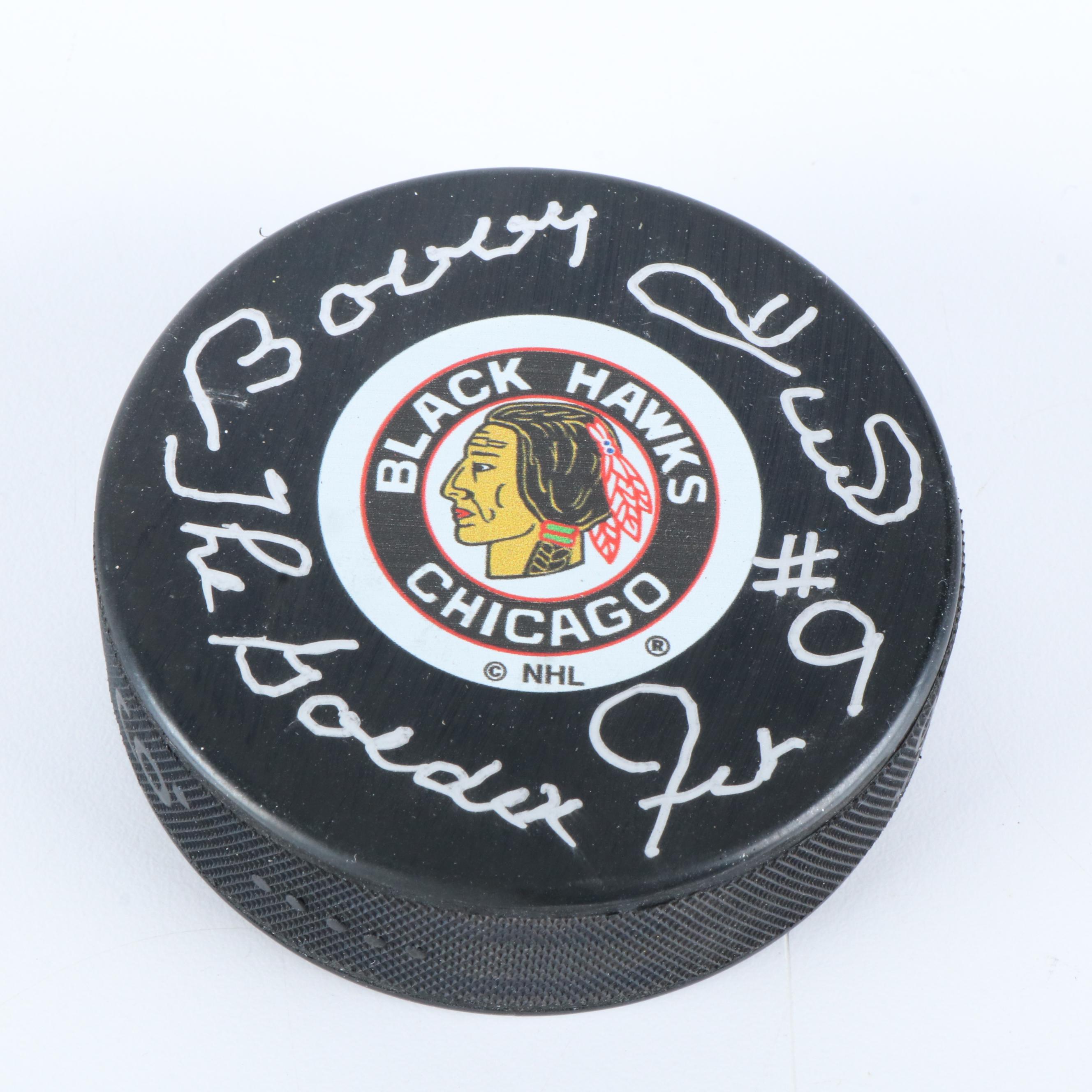 Bobby Hull and Steve Yzerman Signed NHL Hockey Pucks, Beckett | EBTH