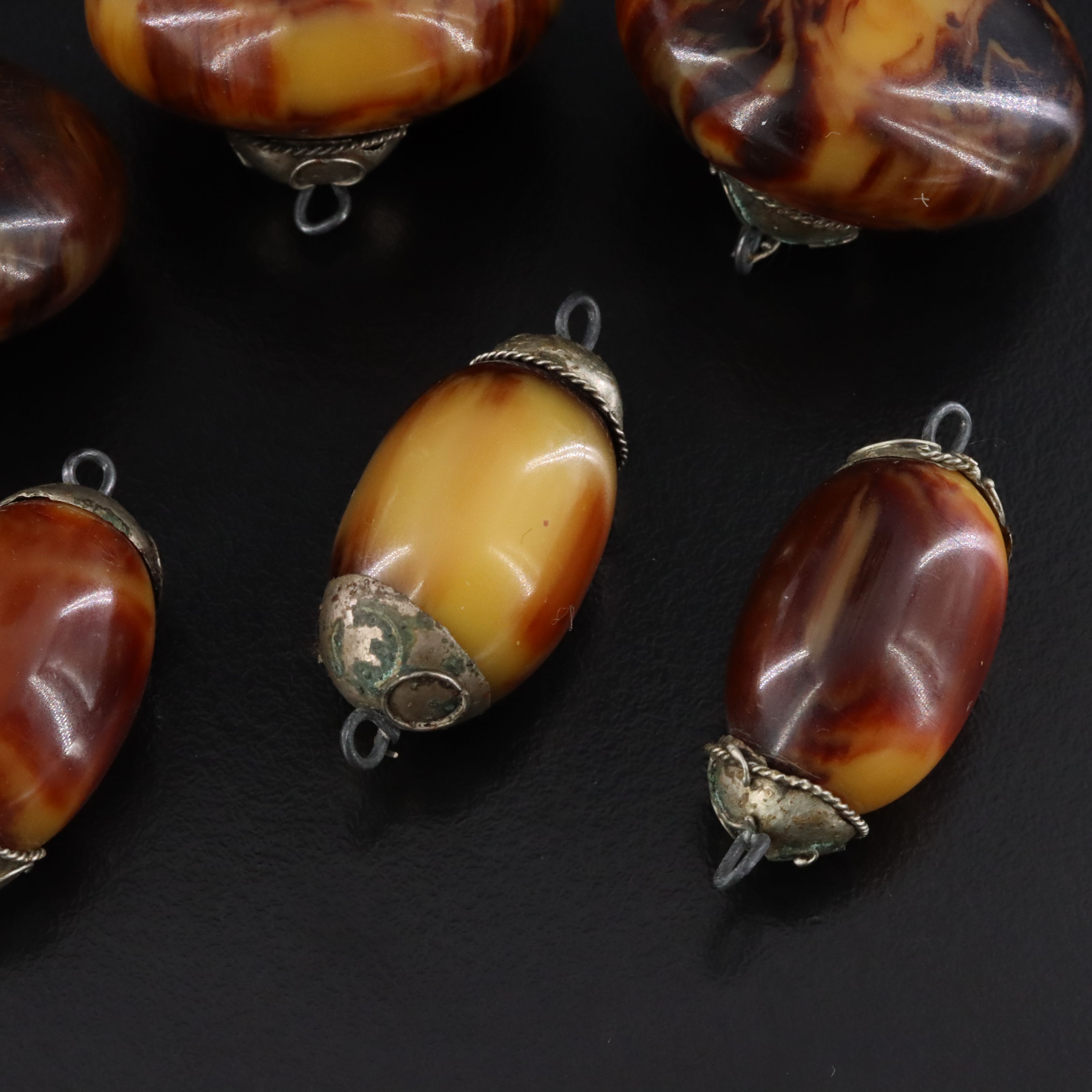 Vintage Marbled Bakelite Beads with Scroll Detail | EBTH